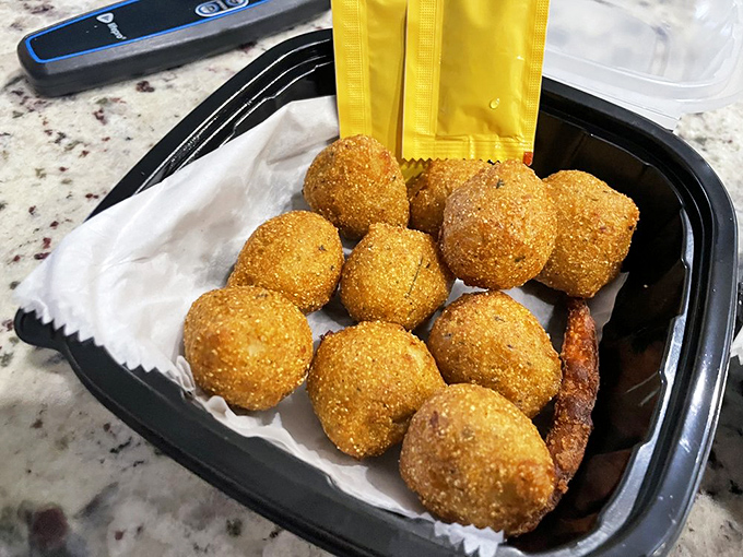 Hush puppies so perfectly golden they deserve their own trophy. These crispy orbs of cornmeal joy are what other side dishes aspire to be.