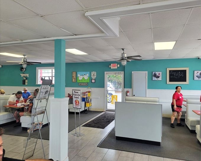 Bright teal walls and classic diner seating create the backdrop for countless morning conversations and coffee refills at this local institution.