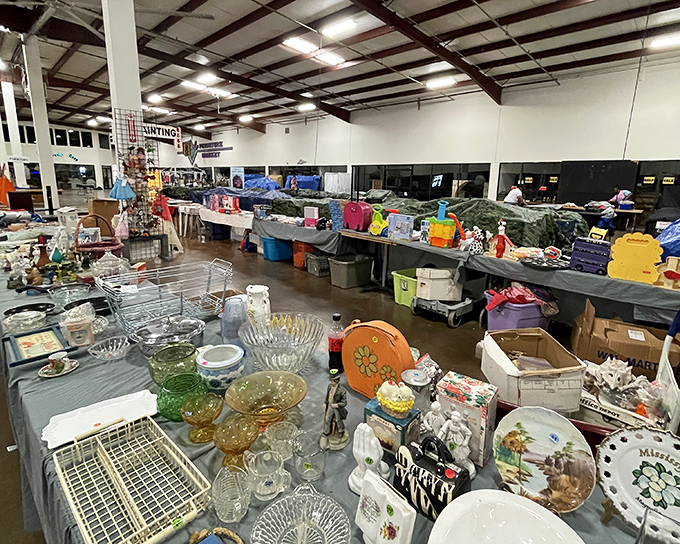Treasure hunter's perspective! Glass bowls catch light while vintage dishware waits patiently for someone to give them a second life.