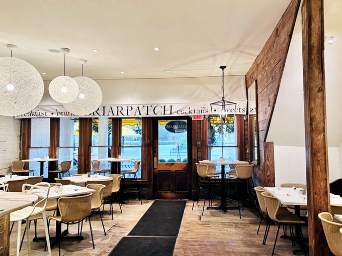 Rustic wooden beams meet elegant white walls&mdash;a dining room that feels like it's giving you a warm hug before the food even arrives.