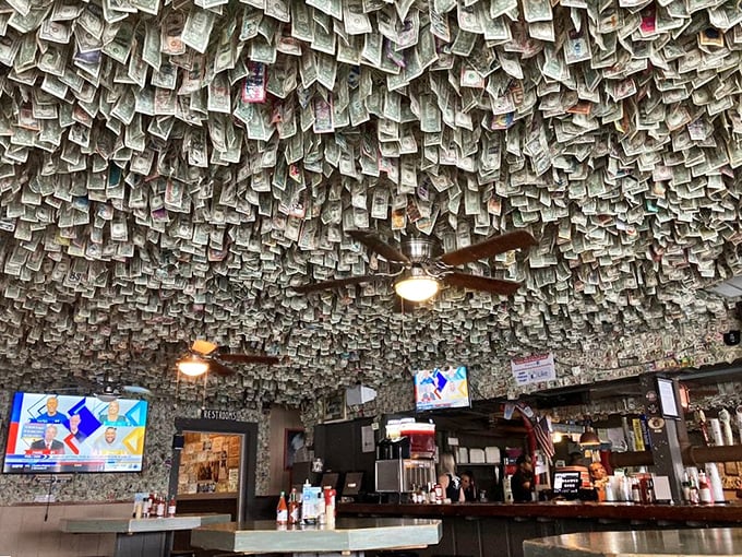The ceiling's dollar bill collection could probably fund a small island nation. It's both decoration and investment portfolio—Florida-style banking at its finest.