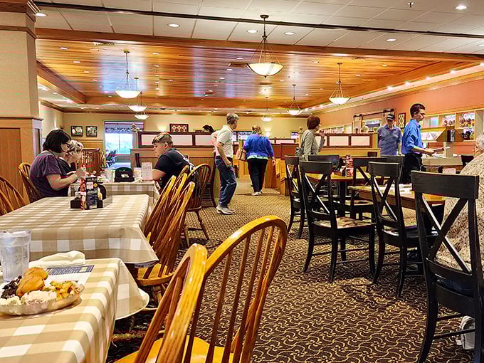 The warm wood ceiling and thoughtful lighting create an atmosphere where lingering over coffee feels not just allowed but encouraged.