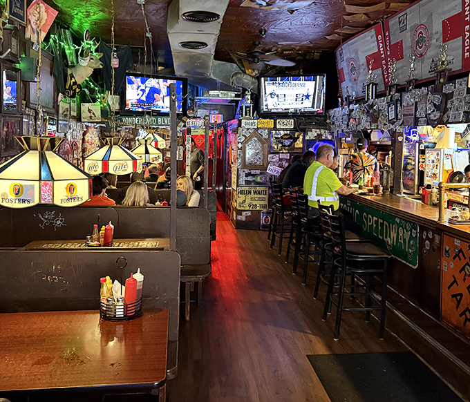 The narrow passage to burger nirvana. Every inch of wall space tells a story, while every table holds the promise of delicious excess.