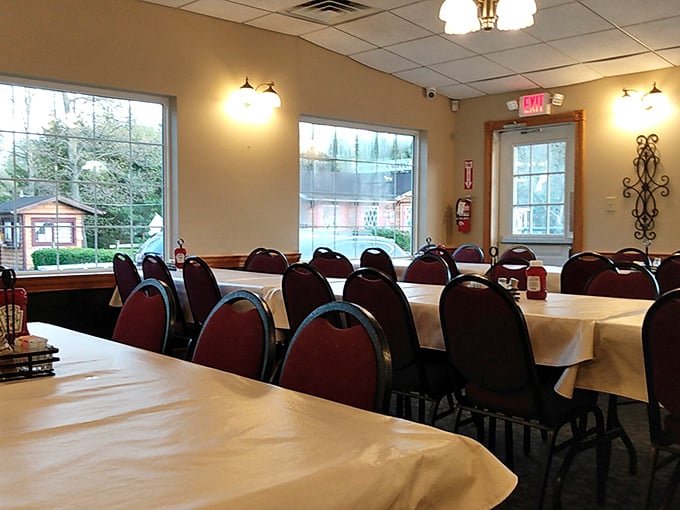 Another dining room view&mdash;where large windows bring nature inside while keeping it far enough away from your perfectly prepared comfort food.