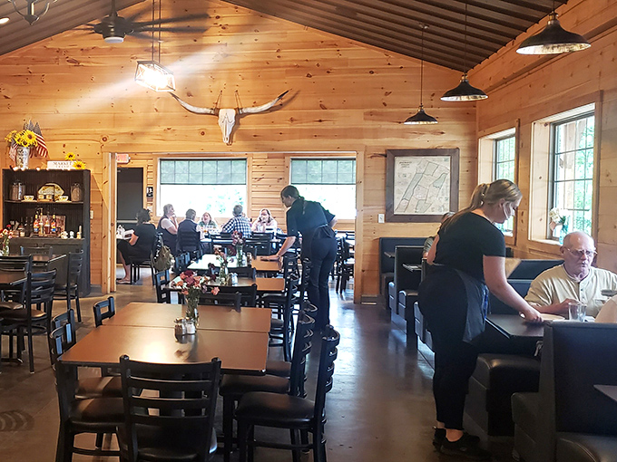 The vaulted ceiling and rustic wooden interior create an atmosphere that's simultaneously spacious and intimate&mdash;like dining in an upscale mountain cabin.