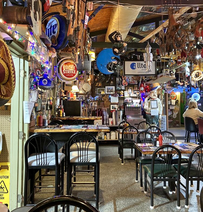 The ceiling and walls serve as a museum of fishing memorabilia, creating an atmosphere that's equal parts nostalgic and fascinating.