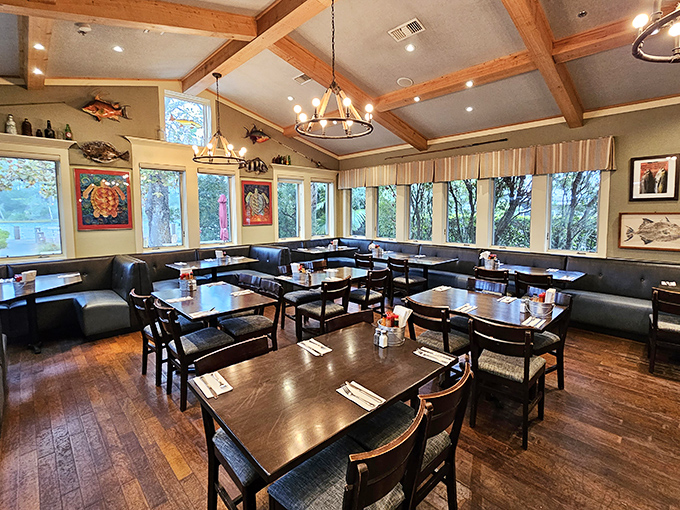 Exposed wooden beams, nautical art, and natural light create that "I could stay here all afternoon" vibe that vacation memories are made of.