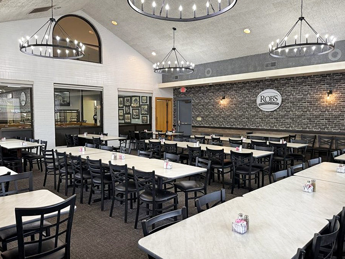 Modern meets traditional in this updated dining space where circular chandeliers cast a warm glow over tables ready to host everything from first dates to family reunions.