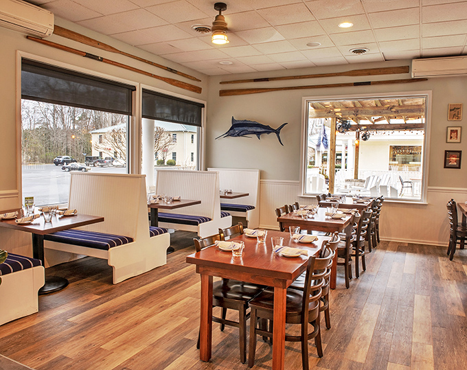Nautical touches like the marlin on the wall remind you of the ocean's bounty without going overboard. This dining room says "fresh seafood" without shouting it.