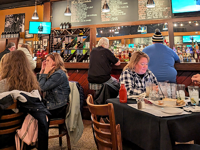 Behind the bar, a liquid library awaits exploration. The chalkboard beer list changes often enough to keep regulars guessing and coming back.