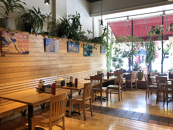 Plants cascade from shelves while natural light floods the space&mdash;proving that vegetables belong in the d&eacute;cor as much as on your plate.