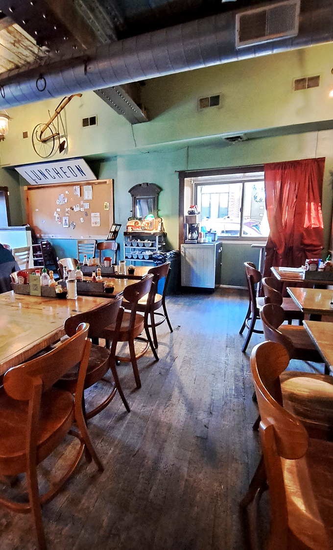 Wooden floors that have supported countless happy diners, beneath exposed ductwork that says "we care about the food, not fancy ceilings."