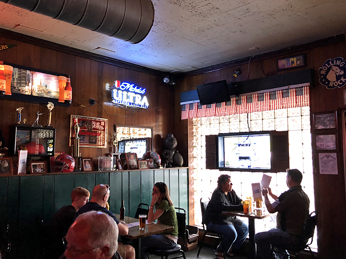 Sunlight filters through glass blocks, illuminating conversations that have been happening here since before cell phones ruined dinner talk.