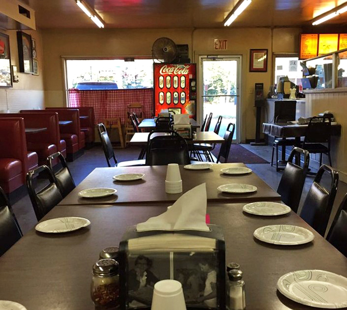 Tables set and waiting for the dinner rush, where conversations will flow as freely as the fountain sodas that wash down those perfect pizza squares.