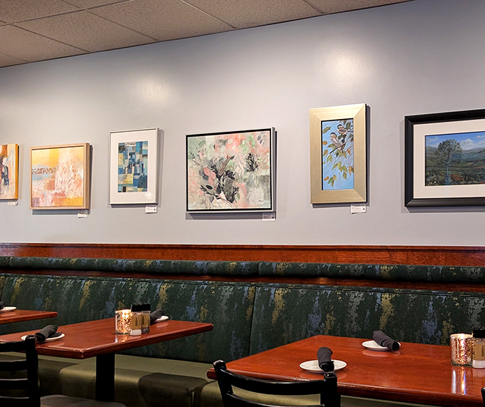 Local artwork and comfortable seating create an atmosphere where conversations flow as smoothly as wine.