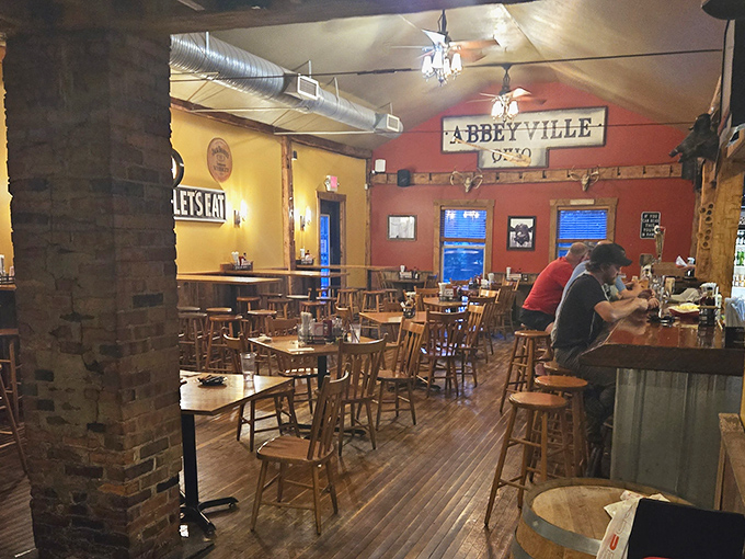 Rustic charm meets serious eating space. The exposed beams and warm lighting create the perfect backdrop for BBQ-induced happiness.