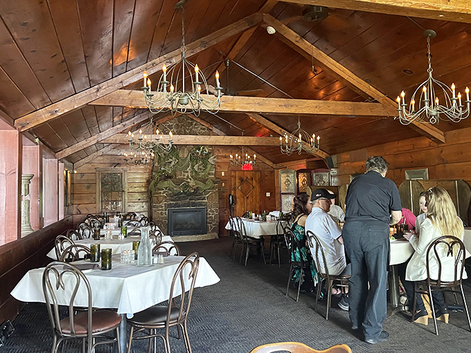 Rustic wooden beams and chandeliers create the perfect "cabin in the woods but make it elegant" vibe that defines Wisconsin supper club magic.