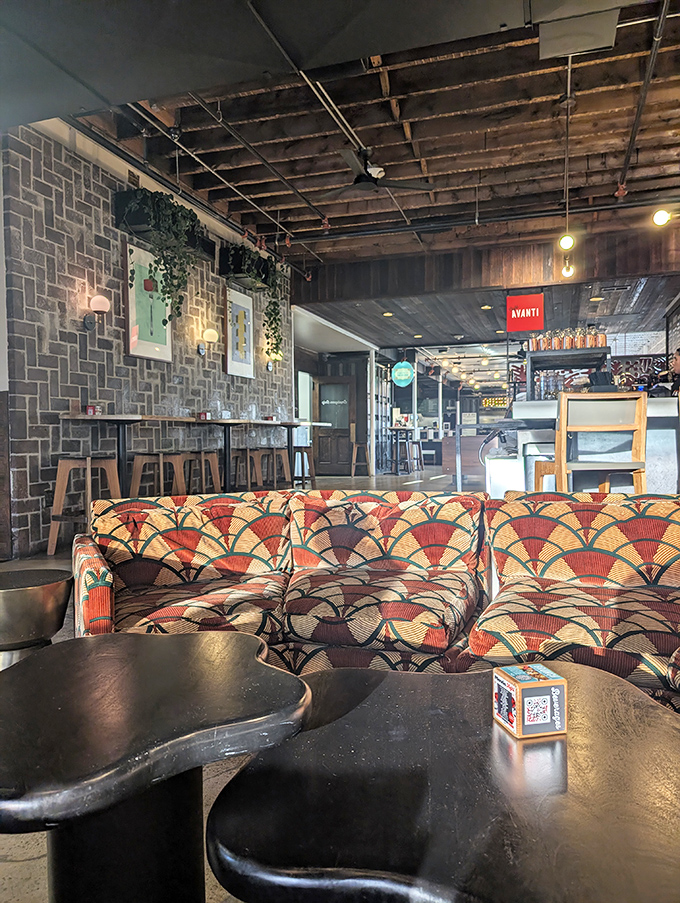 That retro-fabulous couch isn't just seating&mdash;it's a time machine to the era when conversation and comfort were the ultimate dining companions.