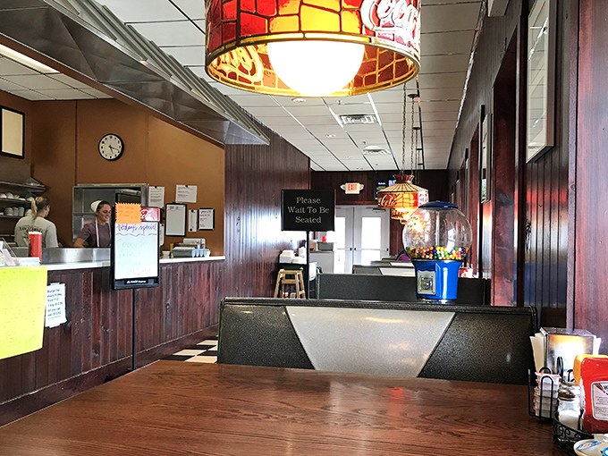 Where wood paneling isn't retro&mdash;it's just never gone out of style. The "Please Wait To Be Seated" sign might as well say "Good Things Come To Those Who Wait."