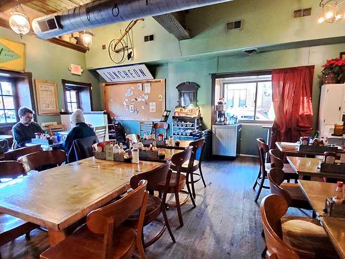 The dining room feels like it was assembled from your coolest relative's attic treasures – mismatched chairs that somehow create perfect harmony.