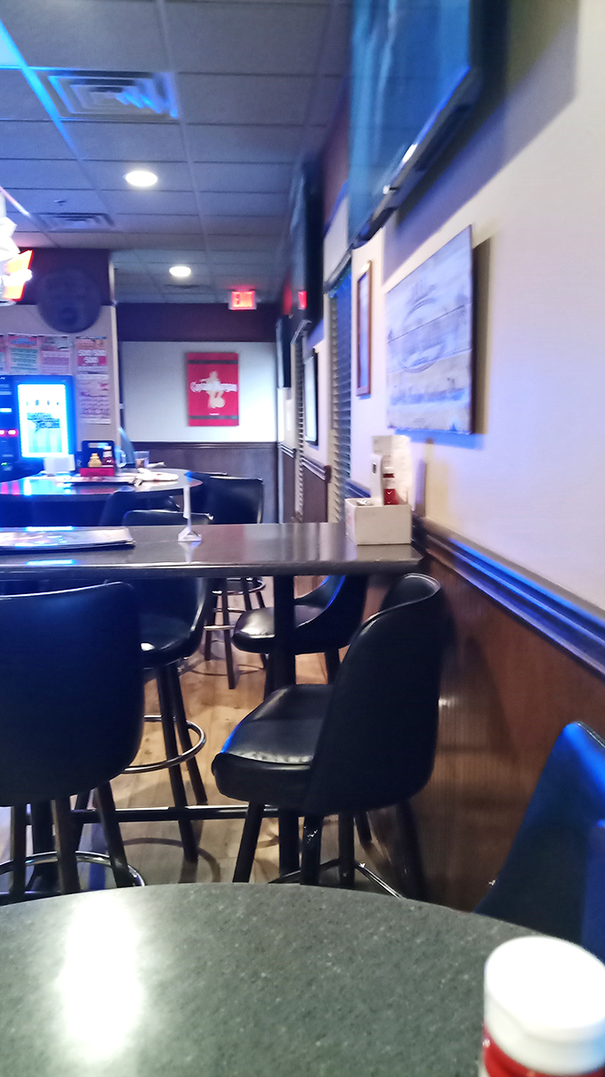 Corner tables perfect for people-watching or intimate conversations. The wood paneling and comfortable seating say, "Stay awhile, order dessert."