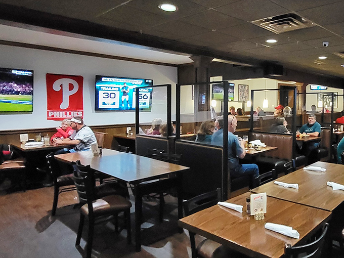 Philadelphia sports memorabilia watches over diners like benevolent spirits. In this temple of fandom, every meal is a home game.