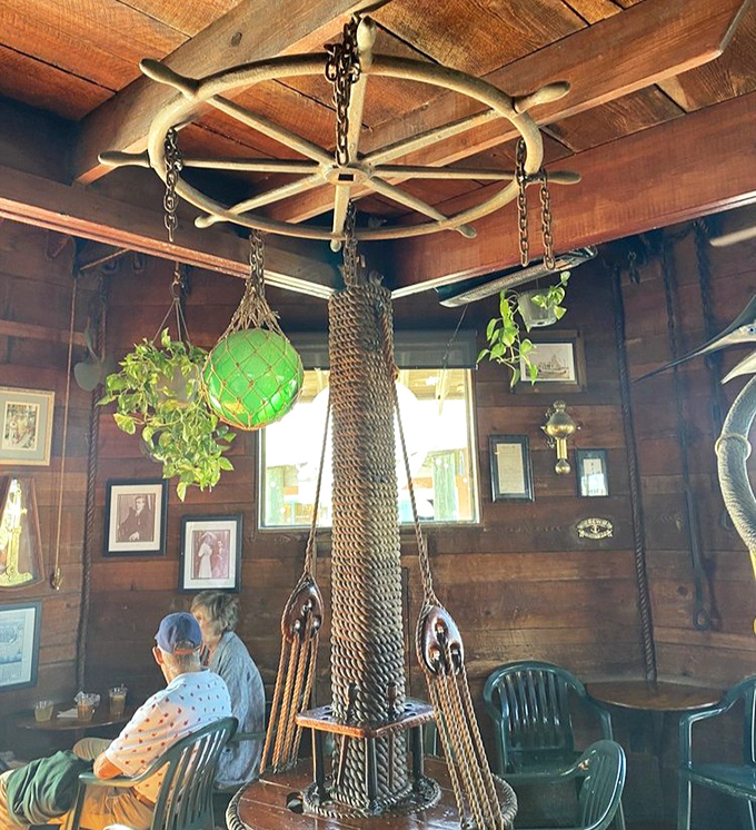 Nautical charm meets rustic elegance with a ship's wheel chandelier that has probably never steered anyone wrong.