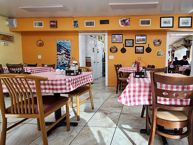 Warm yellow walls and red-checkered tablecloths create the kind of dining room where strangers become friends over shared gravy boats.