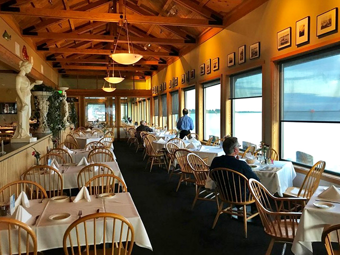 White tablecloths and wooden chairs create an unpretentious elegance, while those windows frame nature's best artwork&mdash;the bay itself.