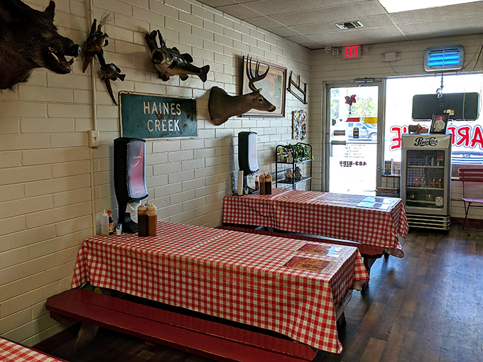 Red and white checkered tablecloths and mounted deer heads &ndash; the classic barbecue joint aesthetic that signals you're in for the real deal.
