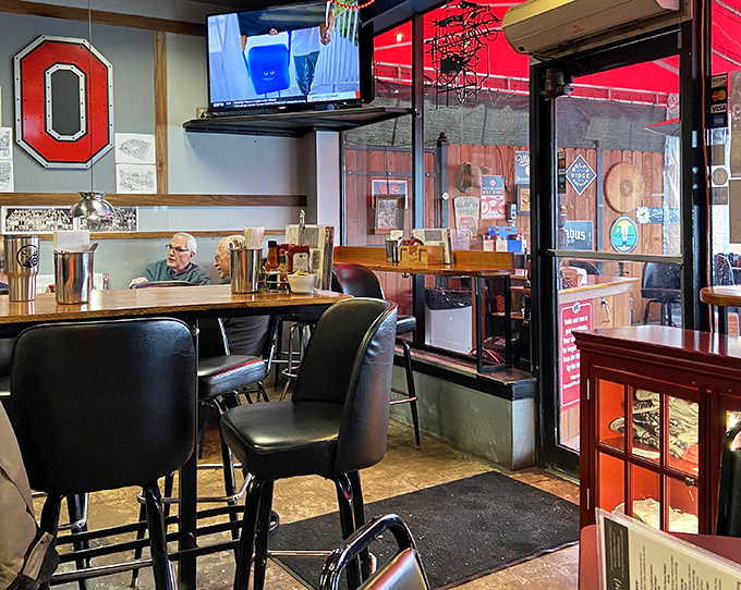 The Ohio State block "O" watches over diners like a patron saint of breakfast, blessing each plate that passes beneath its scarlet and gray gaze. 