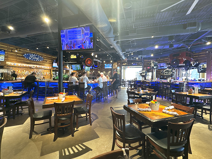 Automotive history meets culinary present. The blue lighting and wooden accents create an atmosphere that's both nostalgic and thoroughly modern.