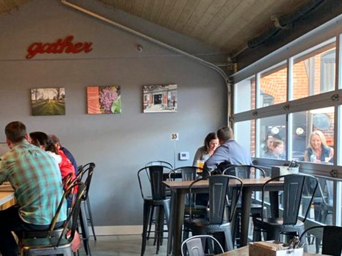 The casual dining room buzzes with anticipation, where locals gather to worship at the altar of authentic smoked meats.