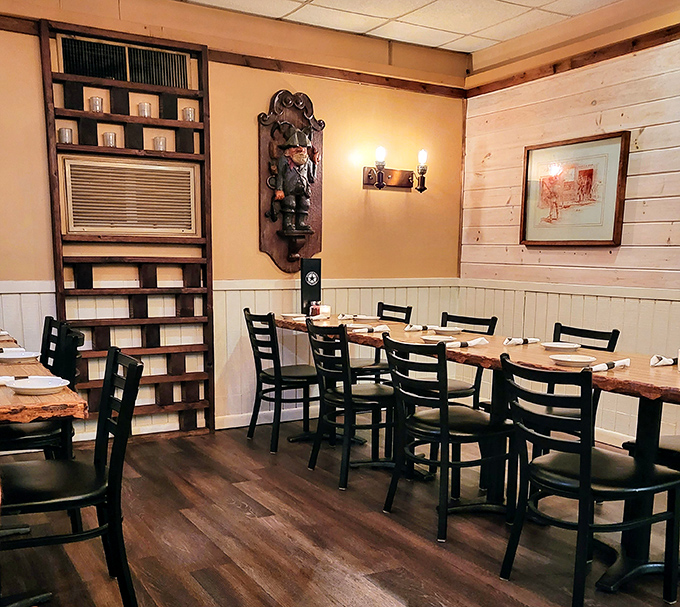 Another dining area showcases the restaurant's rustic charm with pine walls, leather seating, and Western accents that transport you to simpler times.