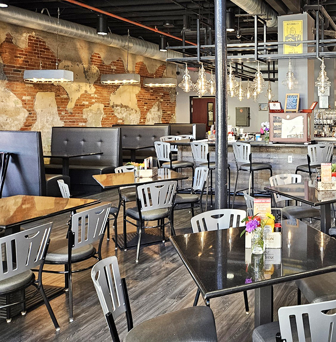 Exposed brick walls tell stories of the building's past while modern furnishings whisper promises of culinary adventures to come.