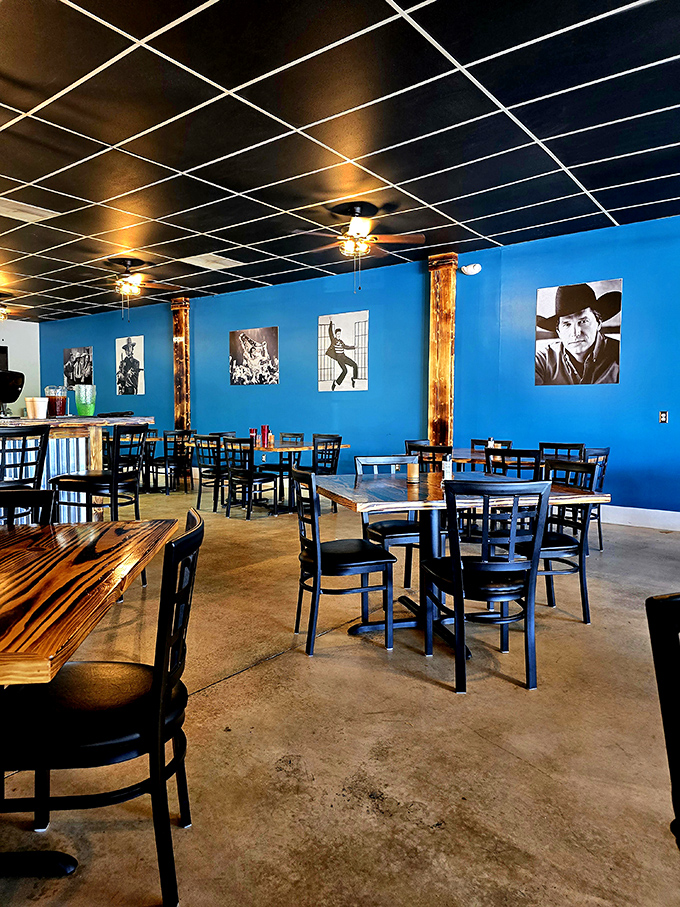 Another angle reveals the thoughtful design &ndash; wooden accents warming up the cool blue walls while ceiling fans keep the atmosphere just right.