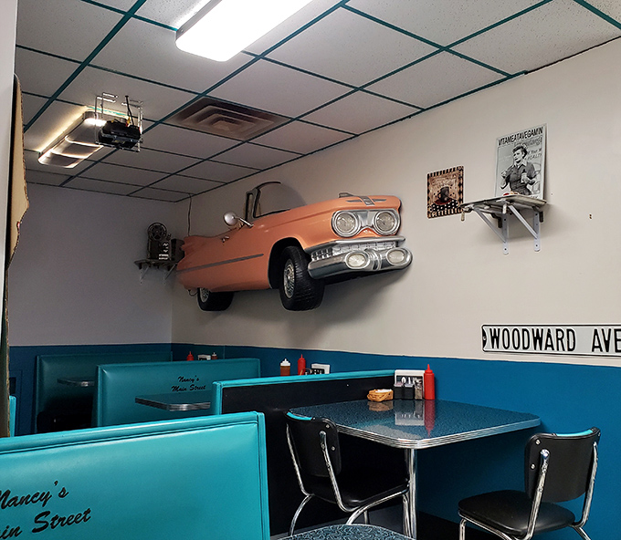 That vintage car mounted on the wall isn't just decor&mdash;it's a conversation starter. Woodward Ave sign completes the time capsule that is Nancy's dining room.