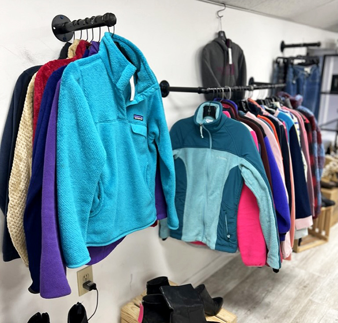 Fleece jackets in vibrant blues hang alongside practical outerwear&mdash;the Pennsylvania equivalent of a winter survival kit at summer sale prices.