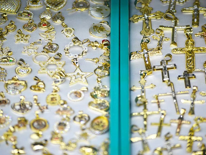 Gold treasures that gleam with promise. Religious symbols and everyday jewelry side by side, each piece telling its own story.