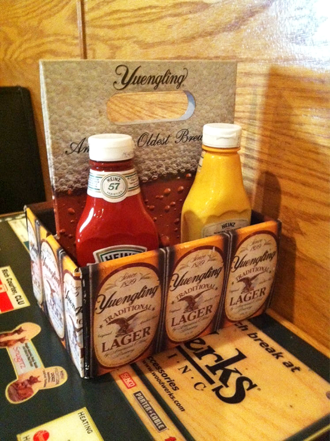 The condiment caddy—humble ambassador of flavor diplomacy. Heinz and French's: bringing peace to burger nations since forever.