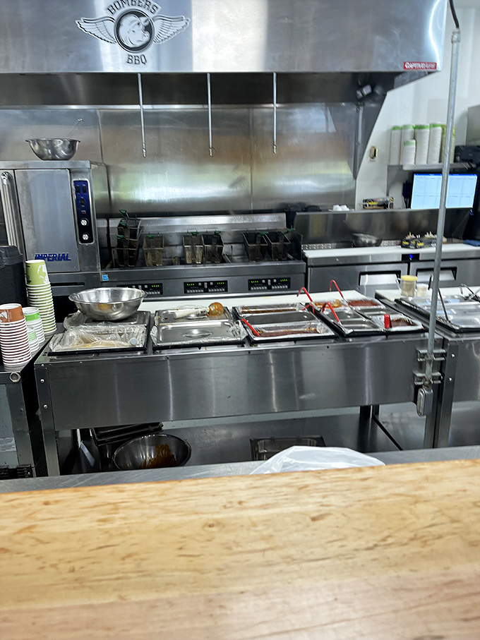 A glimpse into the kitchen reveals the gleaming arsenal where barbecue magic happens &ndash; stainless steel warriors ready for the day's delicious battle.