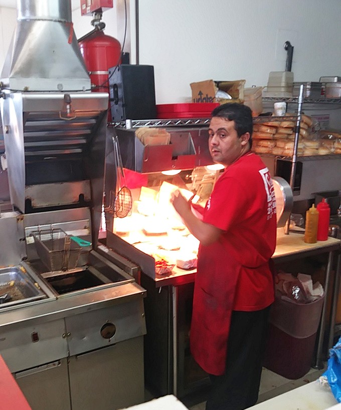 The kitchen ballet: Where burgers are flipped with the precision and care usually reserved for more expensive establishments.
