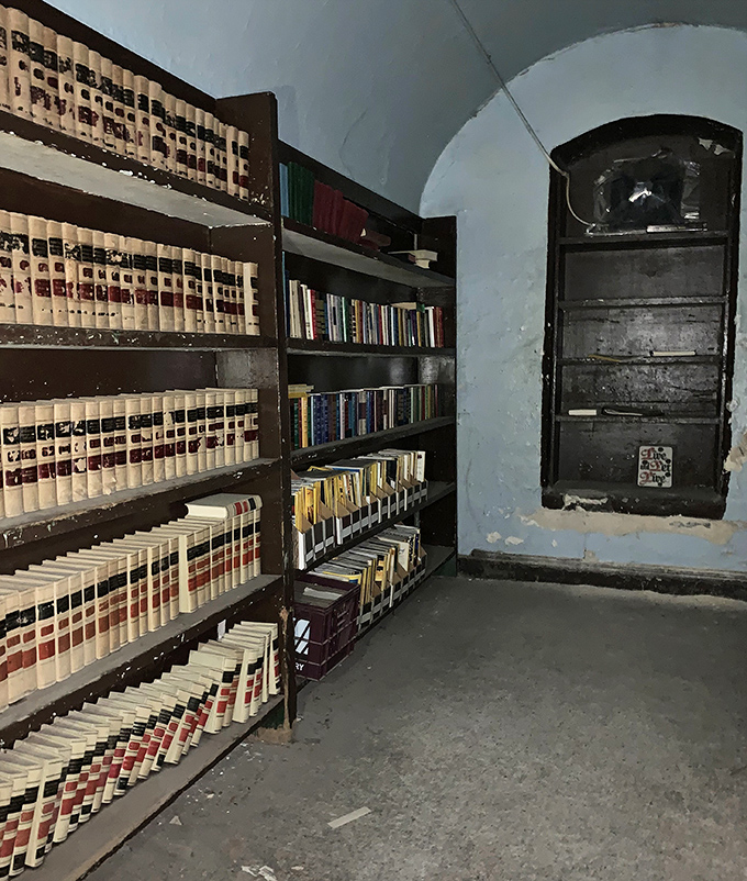 The prison library's well-stocked shelves suggest that even in confinement, books offered an escape of a different kind.