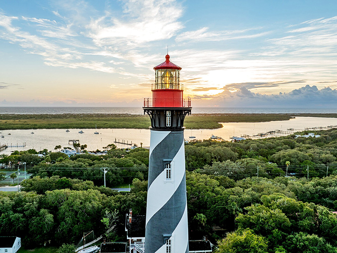 The St. Augustine Lighthouse cuts a dashing figure against the sunset, its spiral stripes saying "this way to safety" for over a century.