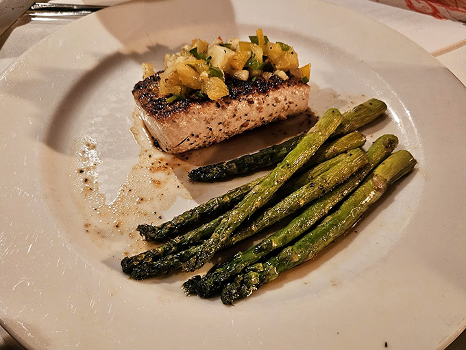 Blackened mahi-mahi that proves inland Virginia can deliver coastal-quality seafood, with asparagus standing at attention alongside.