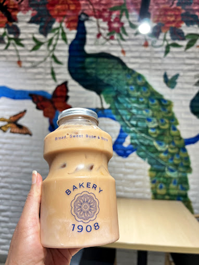 Their signature milk tea, served in an adorably branded bottle, makes the perfect companion for admiring that stunning peacock mural.