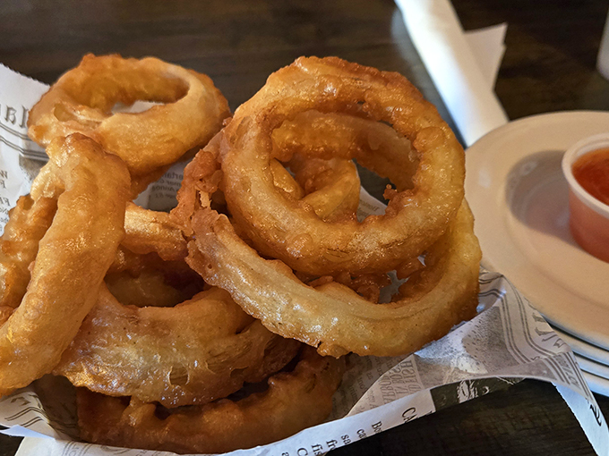 Onion rings with architectural integrity&mdash;crispy, golden hoops that maintain their structure from plate to palate. No soggy disappointments here.