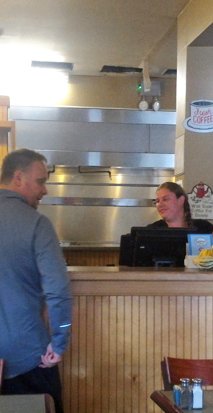 Where the magic happens: The counter where friendly faces turn coffee cups into bottomless wells of caffeinated joy.
