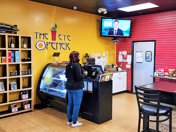 The counter area showcases local pride with merchandise and a display case that whispers, "Yes, we have pastries too."