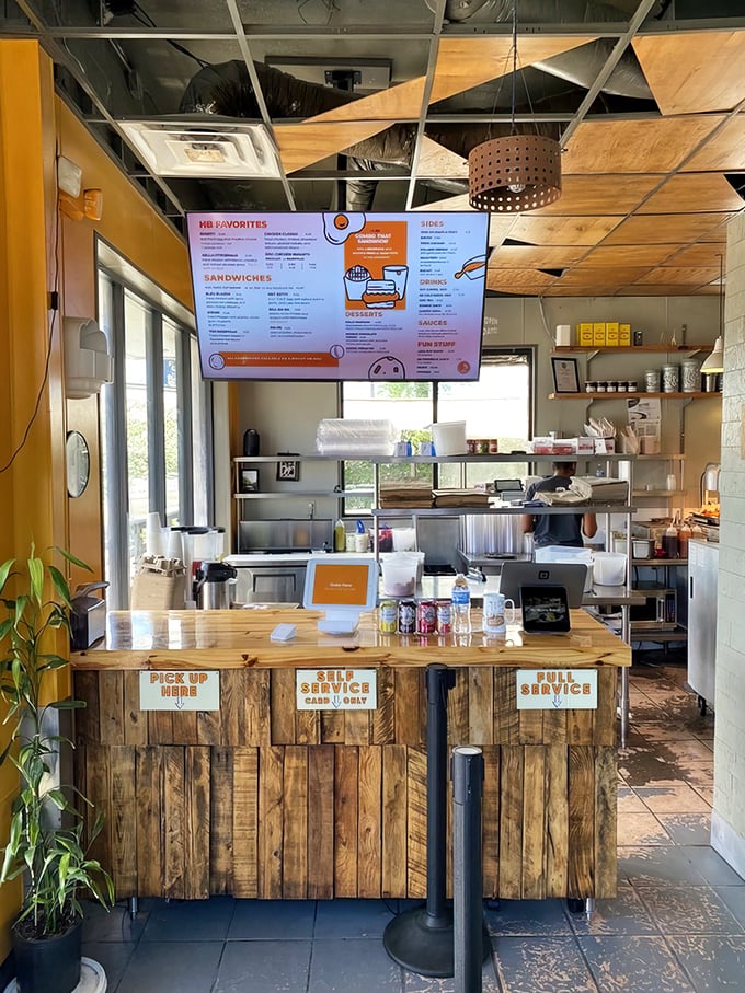 The ordering counter&mdash;where dreams become reality. Simple signage and wooden panels say, "We're serious about biscuits, not about pretension."